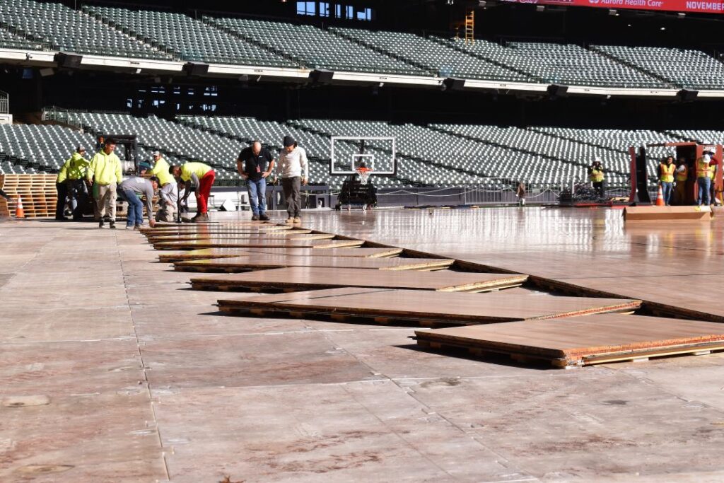 See photos: Crews work to set up basketball court at American Family ...