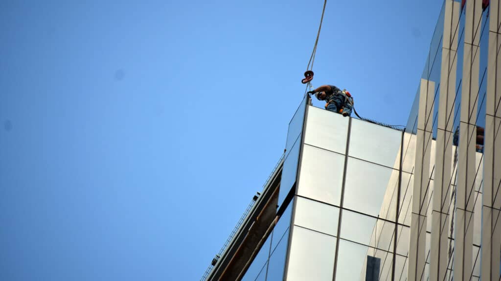 See photos: Installation of BMO Tower's glass exterior slated for ...