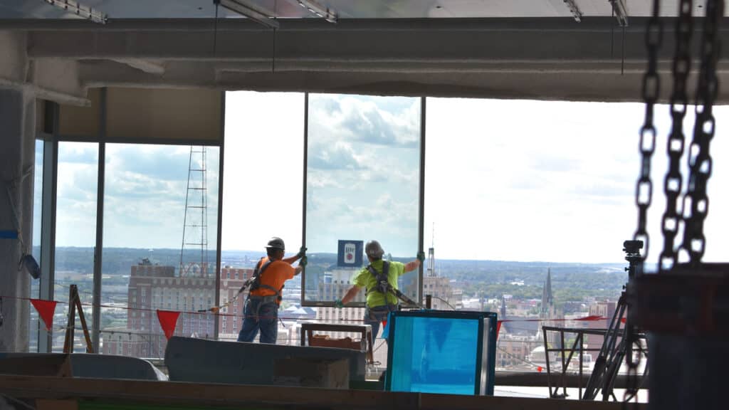 See photos: Installation of BMO Tower's glass exterior slated for ...